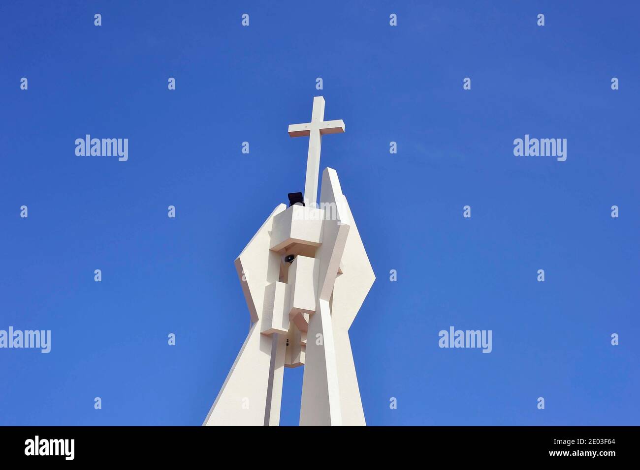 Top view of white cross sign with blue sky background. Christianity ...