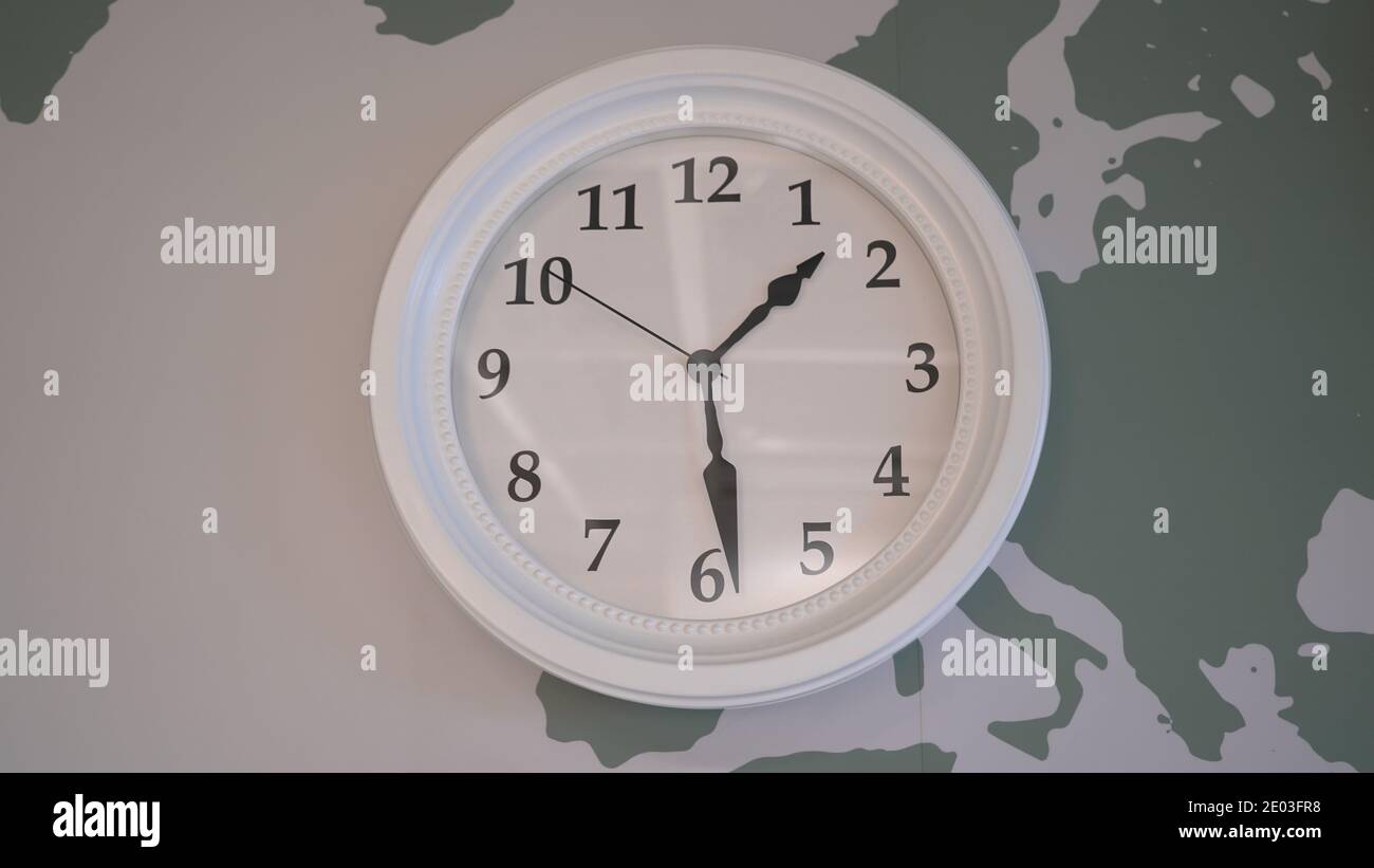 The white wall clock on the map wallpaper background shows 1:30, time ...