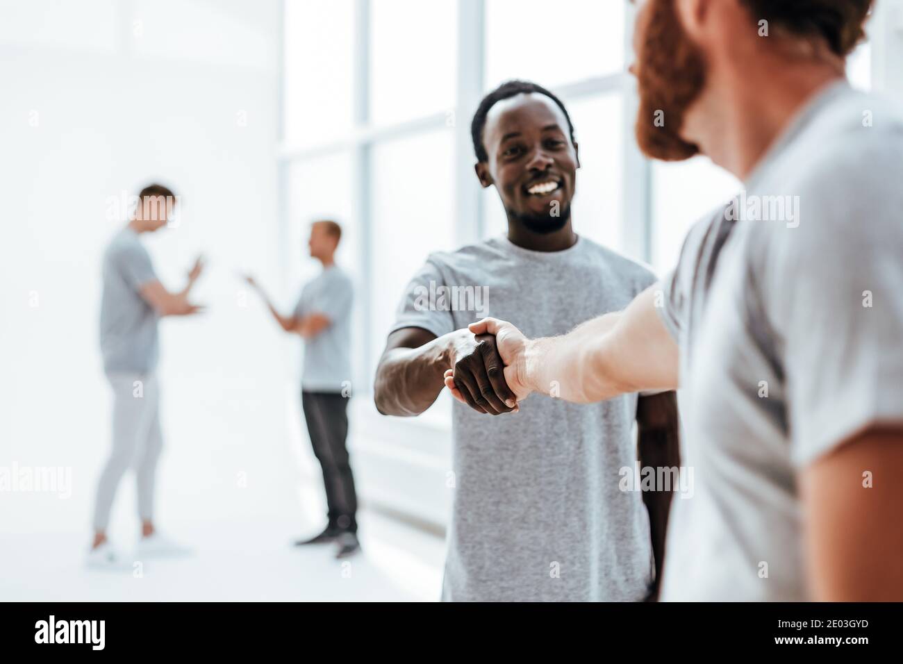 close up. friendly handshake of young people Stock Photo - Alamy