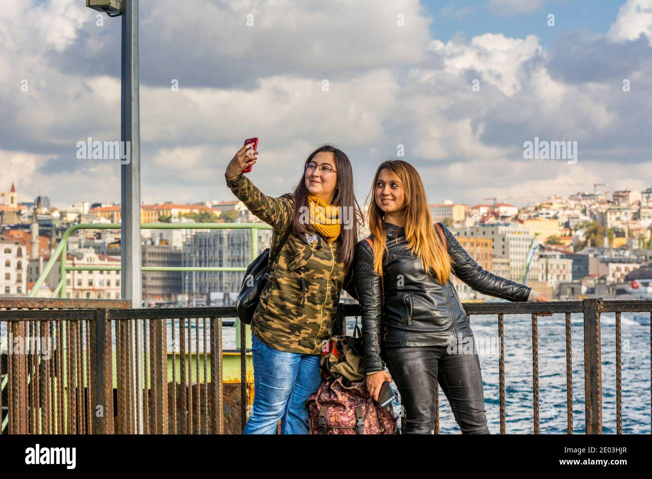 Two blond beautiful Turkish girls taking selfies with cellphone at the ...