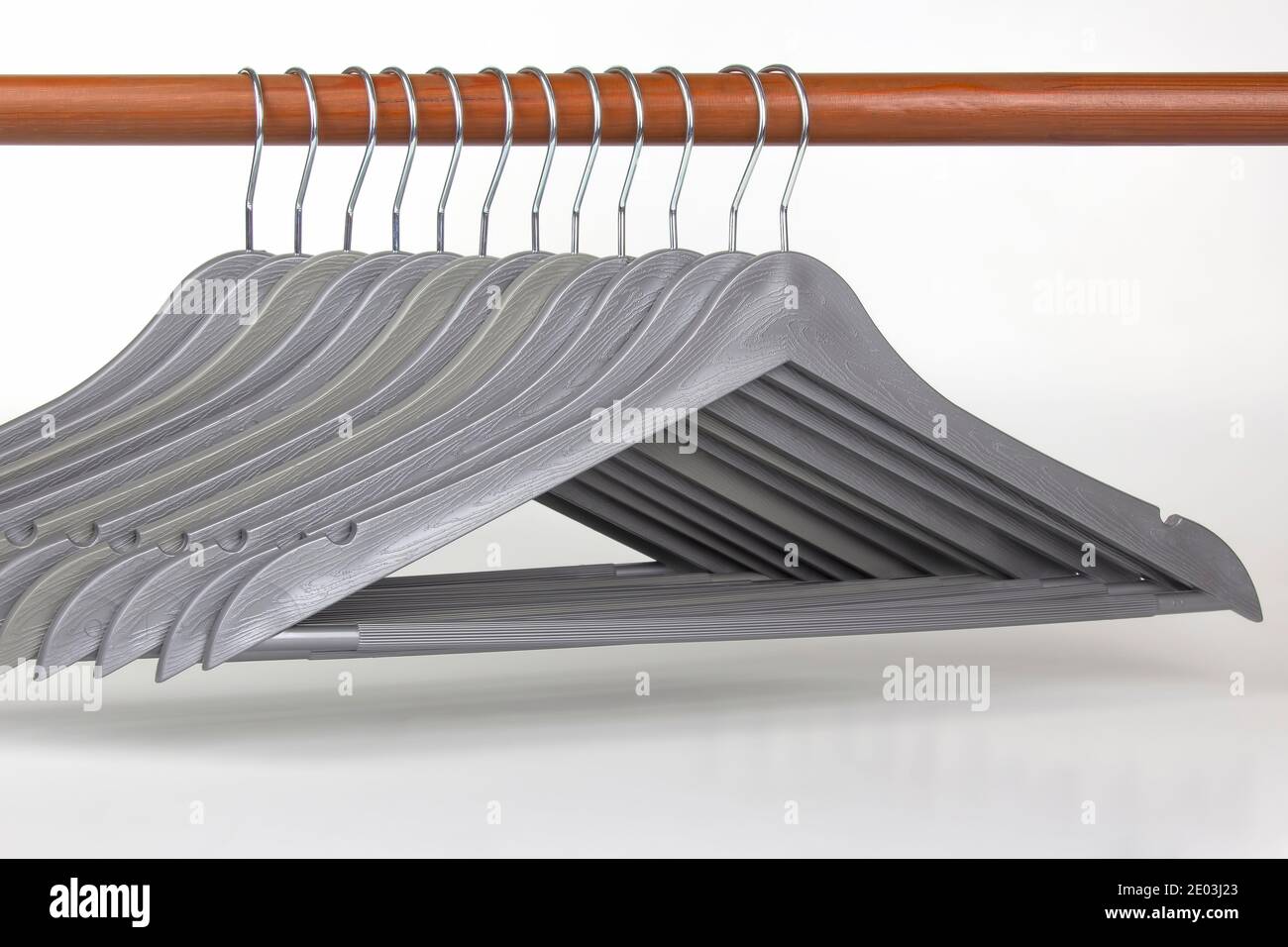 Set of gray clothes hangers on a white background Stock Photo - Alamy