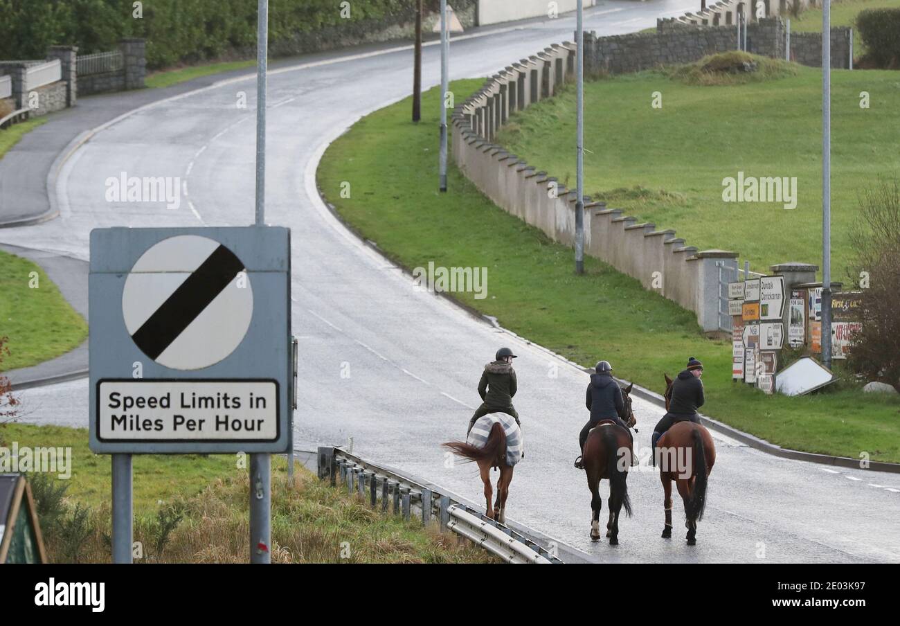 A group of horse riders crosses the border from the Republic of Ireland ...