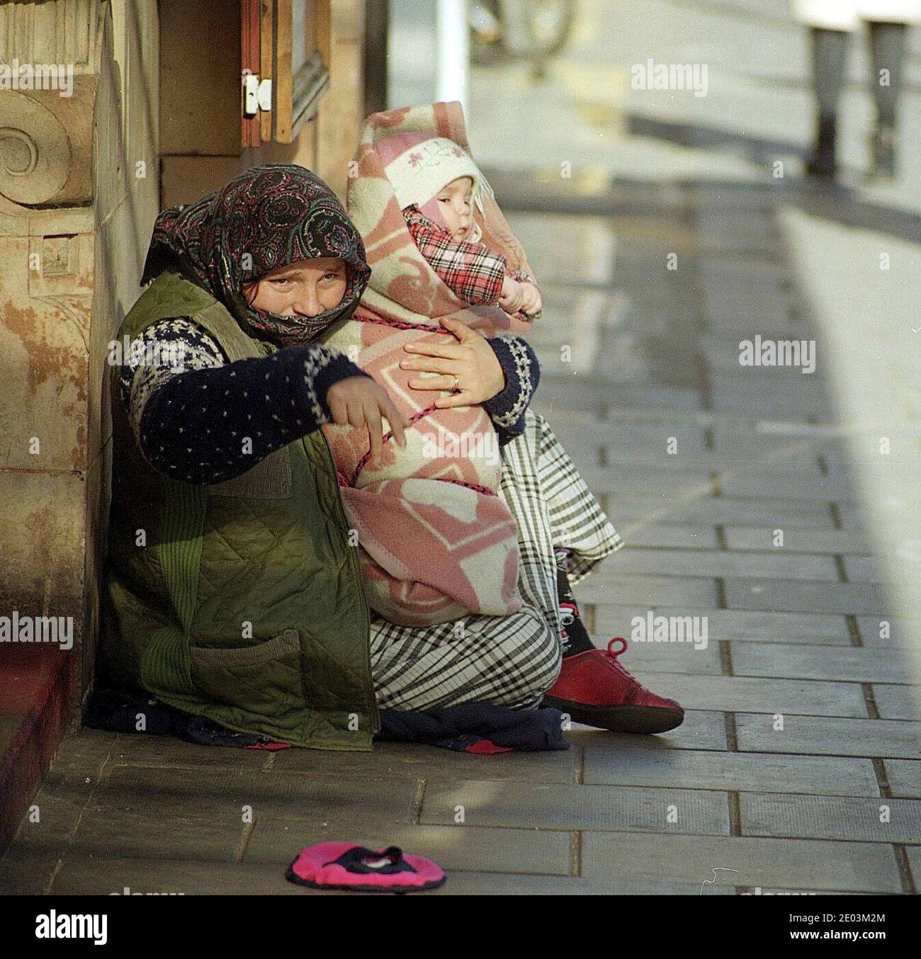Beggar from Eastern European, with infant child Hackney. LondonRich ...