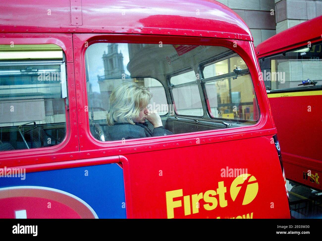 Female Bus Passenger on top deck of red First London bus Central London ...