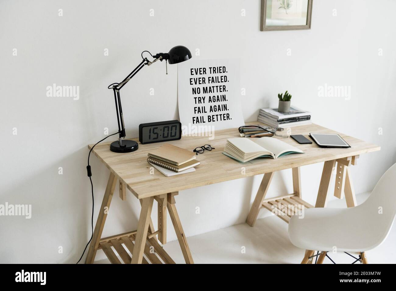 desk setup with motivational poster Stock Photo - Alamy