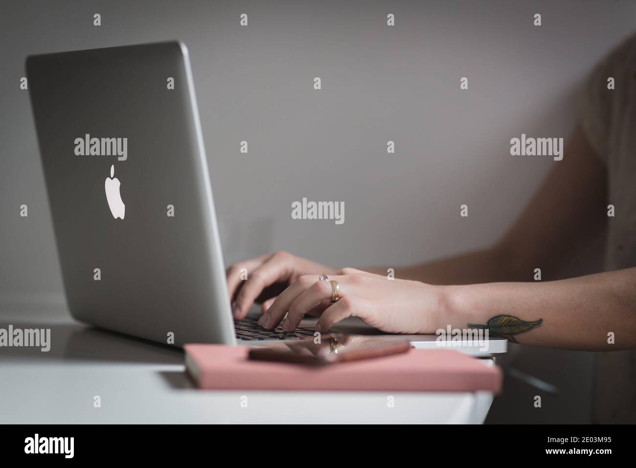 freelancer typing on keyboard Stock Photo - Alamy