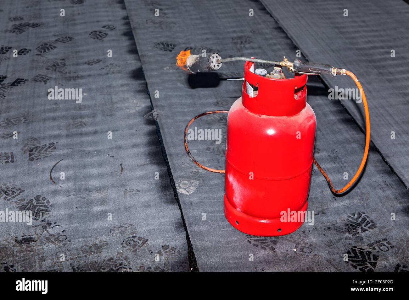 Gas burner on the construction of a family house. Asphalt floor ...