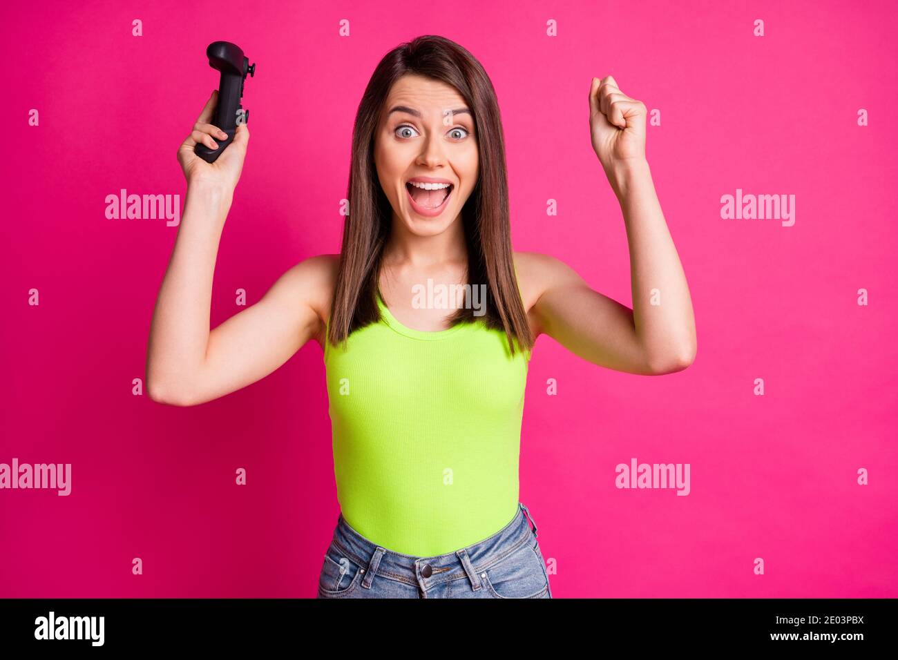 Photo of happy girl celebrate win victory yell yeah video game fists ...
