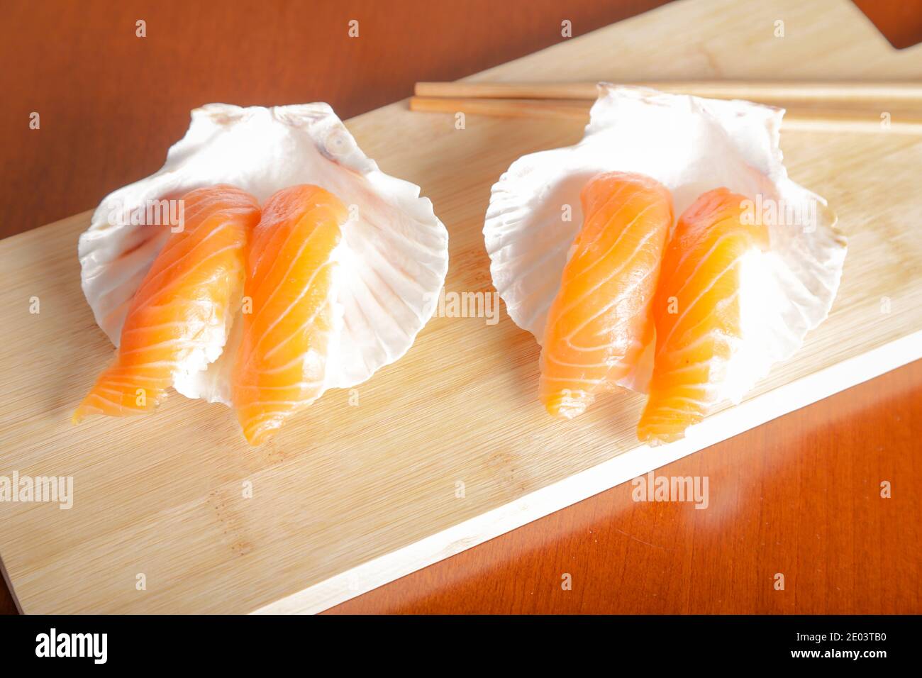 Salmon sushi typical of Japanese cuisine on white shell, natural light ...