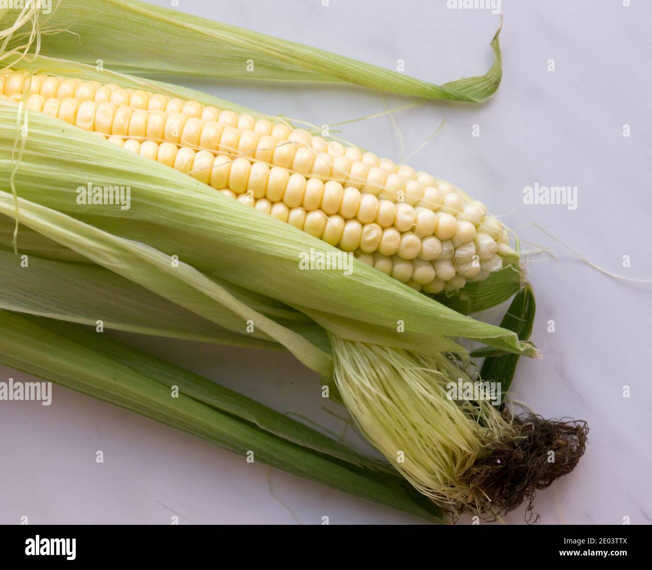 The yellow nature corn on a marble background Stock Photo - Alamy