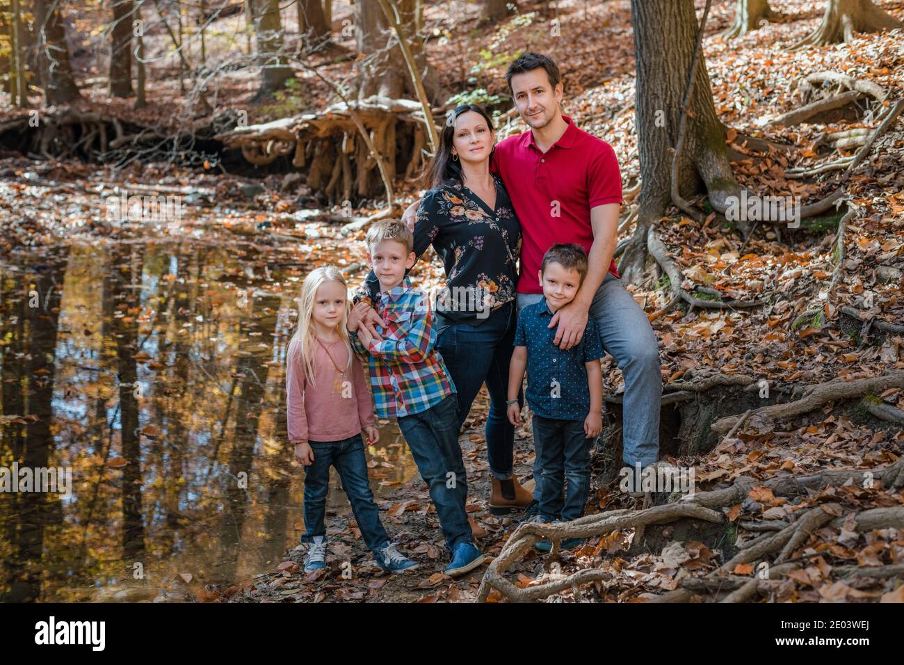 Family portrait with three children outside on fall day Stock Photo - Alamy