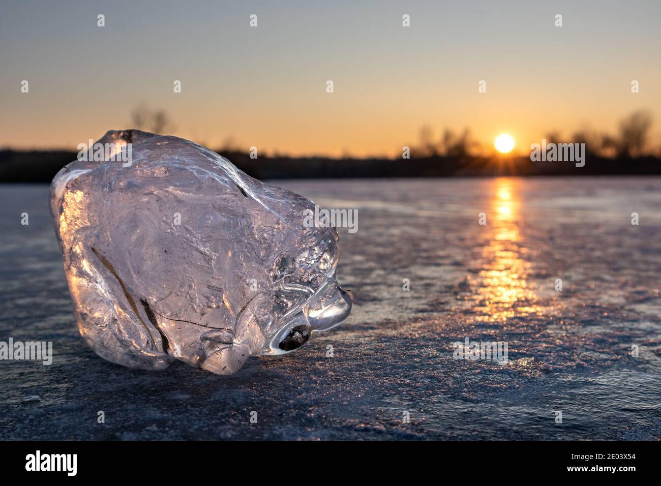 Transparent shining clear ice close-up sparkling on frozen wild lake ...