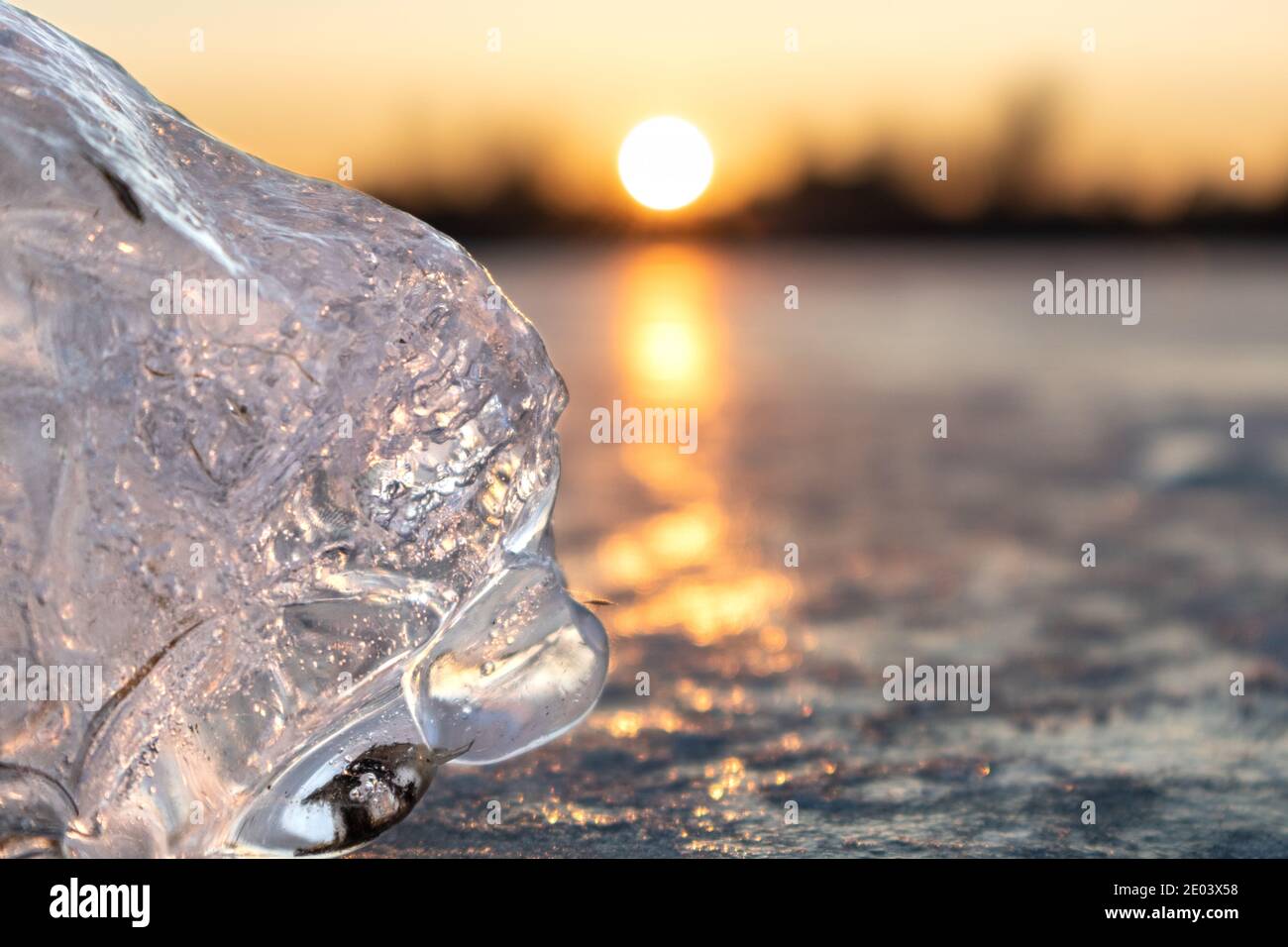 Transparent shining clear ice close-up sparkling on frozen wild lake ...