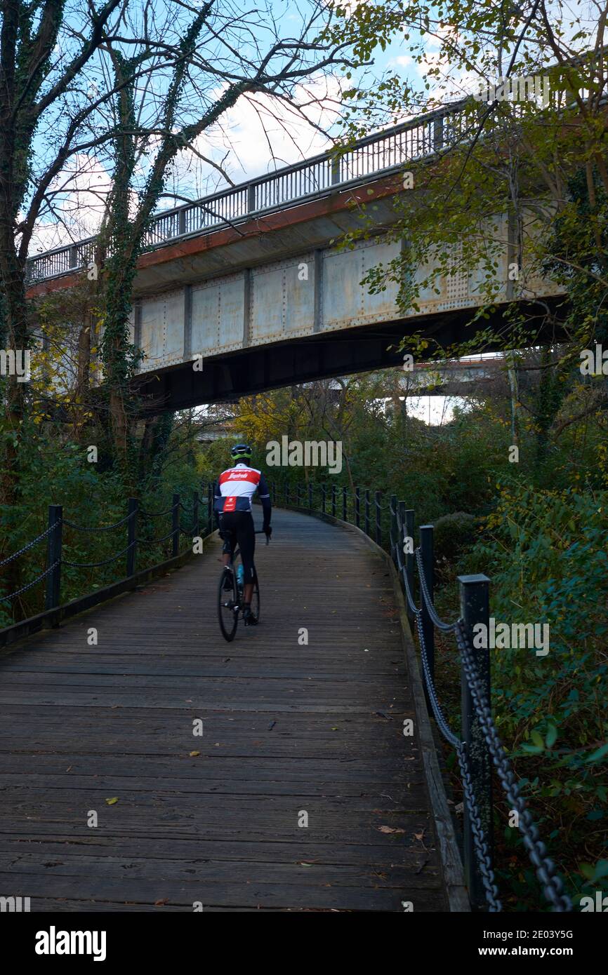 A cyclist uses the Mt Vernon trail boardwalk path as it passes under ...