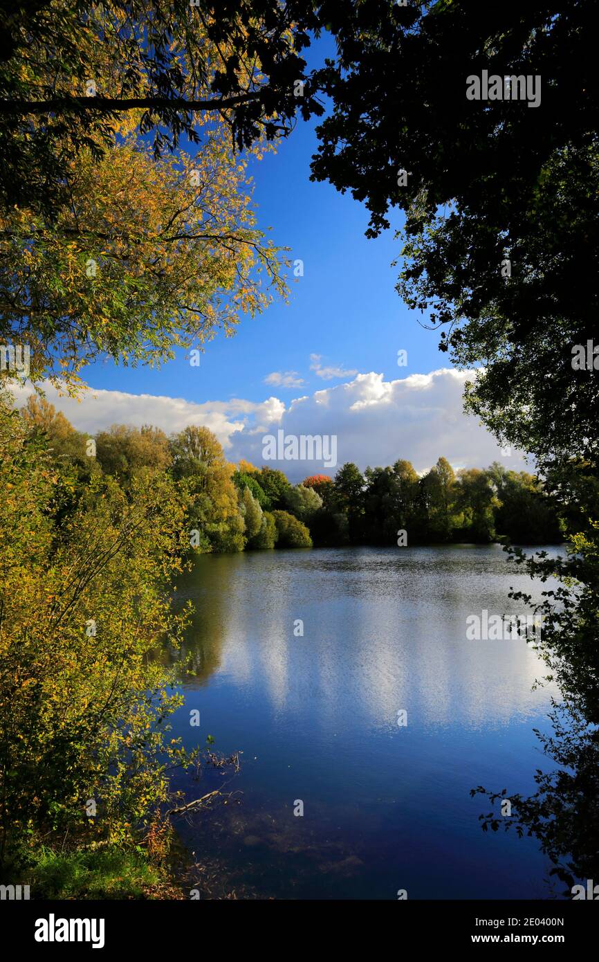 Autumn colours over the lake at Barnwell Country Park, Oundle town ...