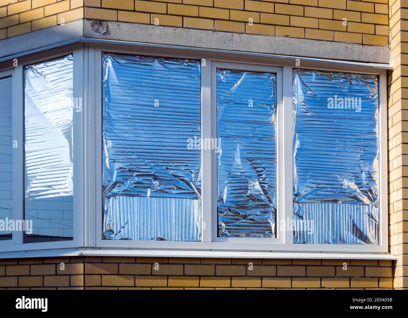 Using sun protection film on the window Stock Photo - Alamy