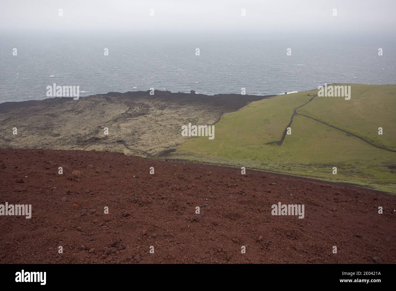 Triangle of lava, rock and grass Stock Photo - Alamy