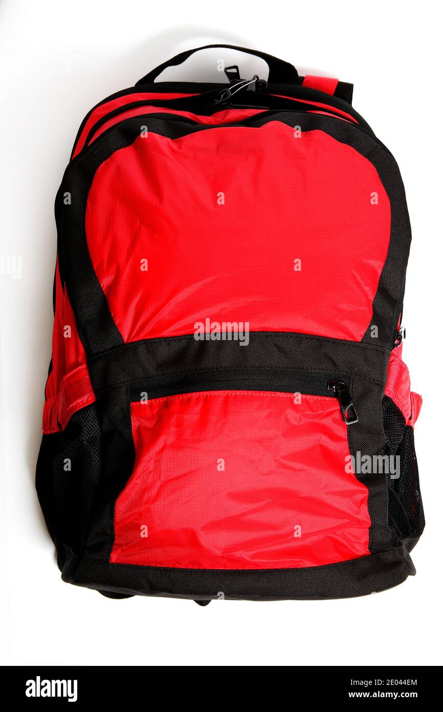 Red backpack with black details isolated on white background. For ...