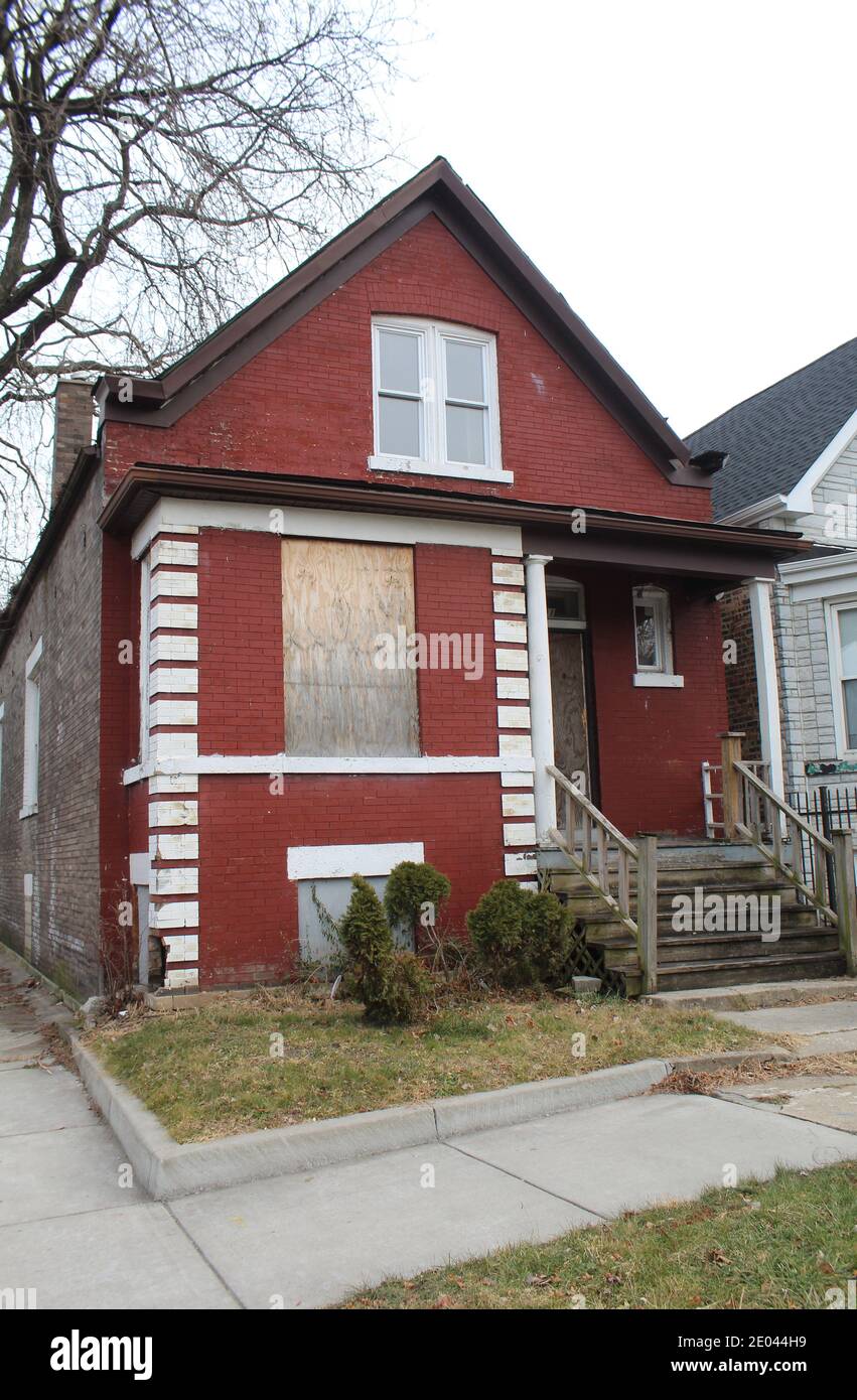 Boarded up abandoned red brick home in Englewood on Chicago's South ...