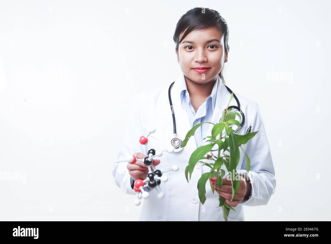 A female doctor holding a herbal plant and chemical matrix Stock Photo ...