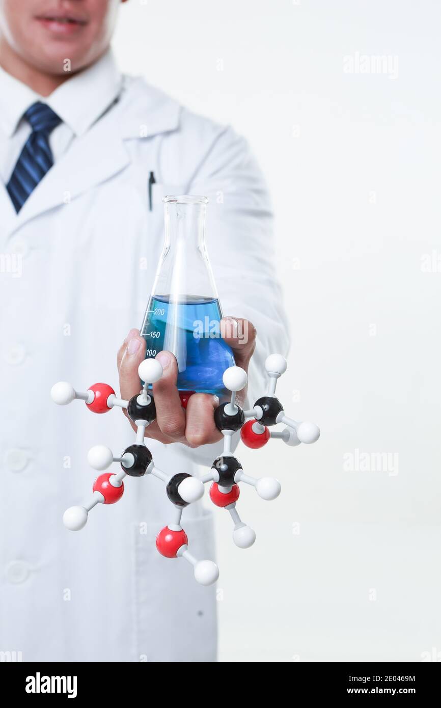 A chemist holding a flask and chemical matrix Stock Photo - Alamy