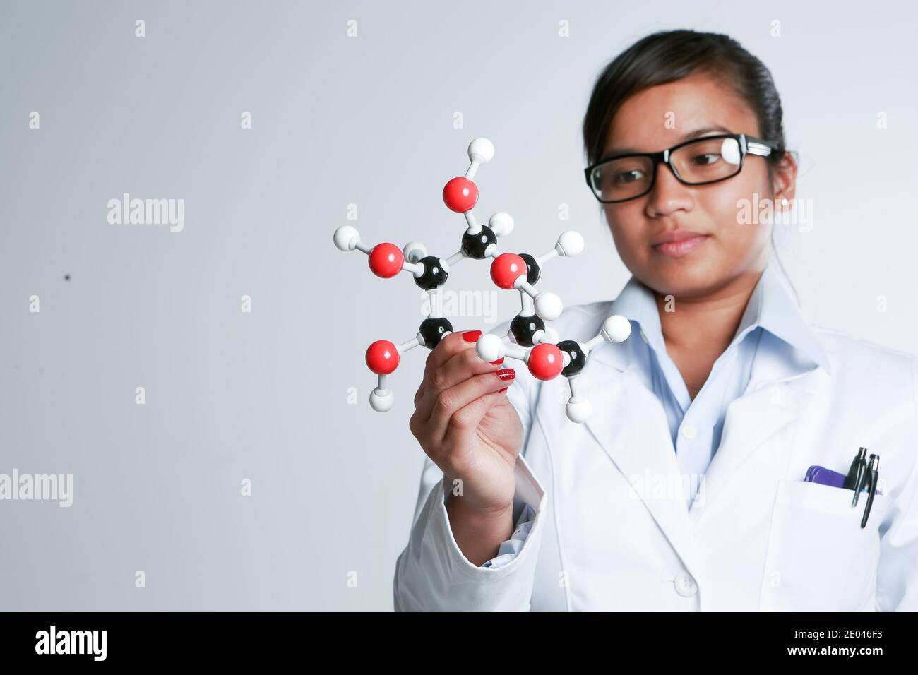 An asian female medicinal chemist holding a chemical matrix Stock Photo ...