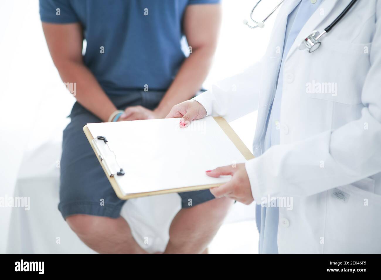 A doctor checking the patients results Stock Photo - Alamy