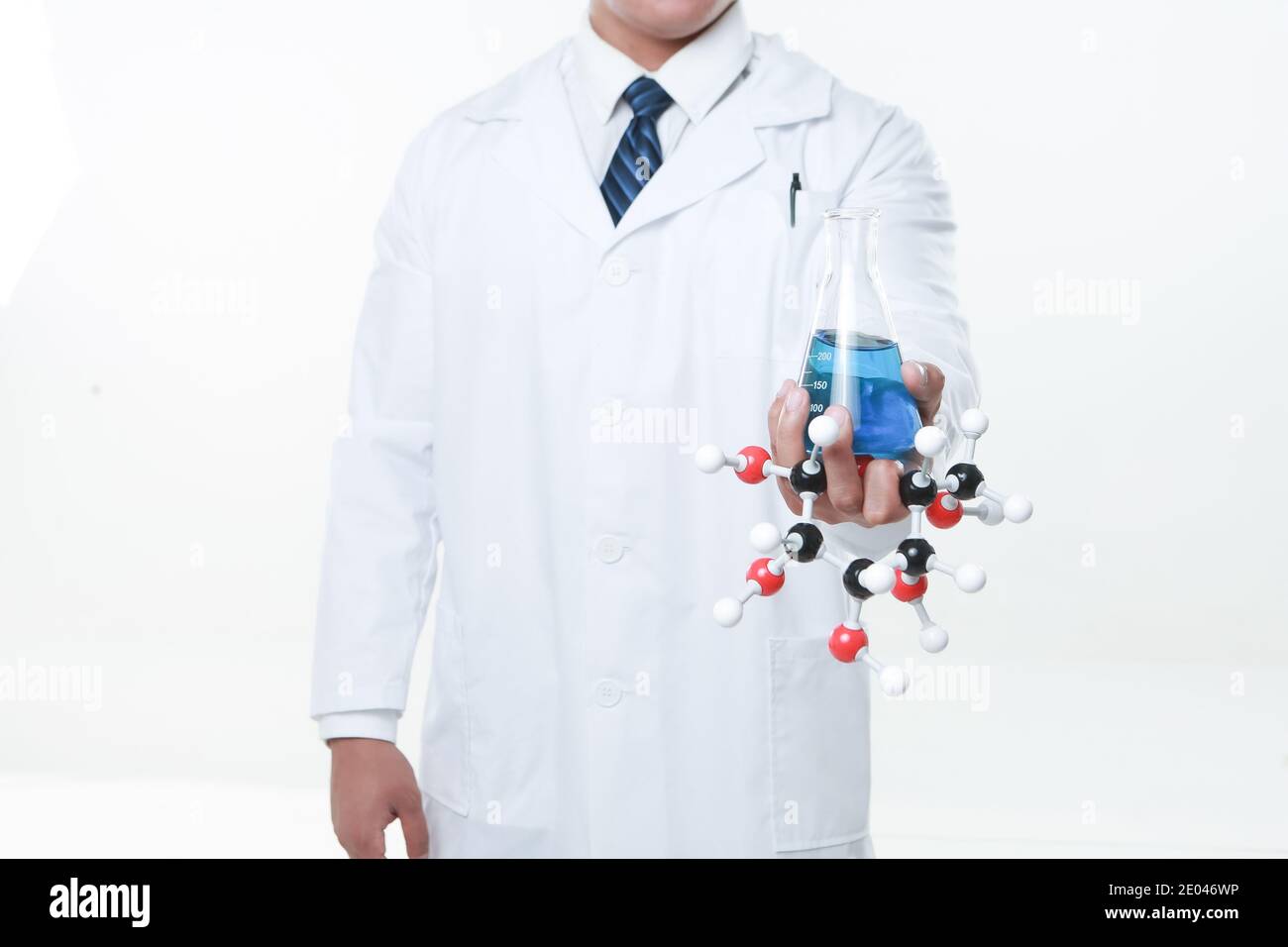 A chemist holding a flask and chemical matrix Stock Photo - Alamy