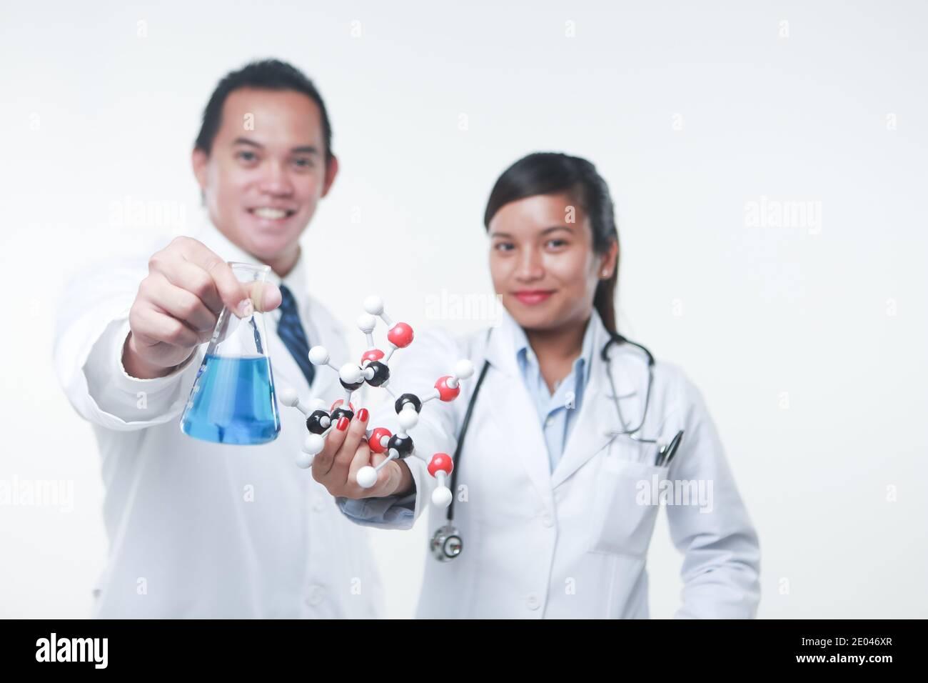 Doctor and chemist working together with chemicals and chemical matrix ...