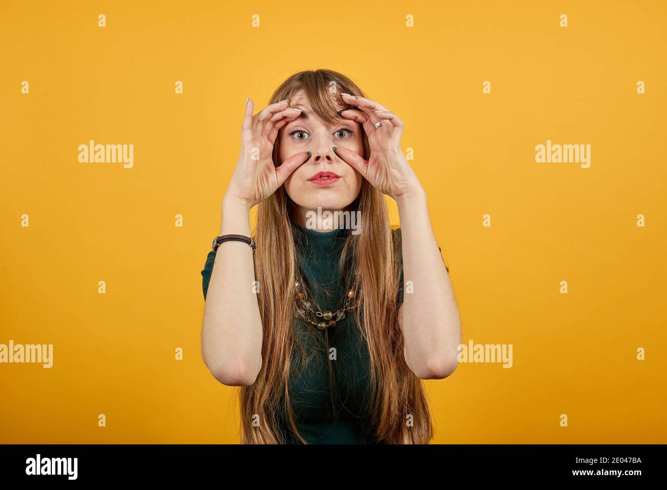 Young trying to open eyes with fingers, sleepy, tired for morning ...