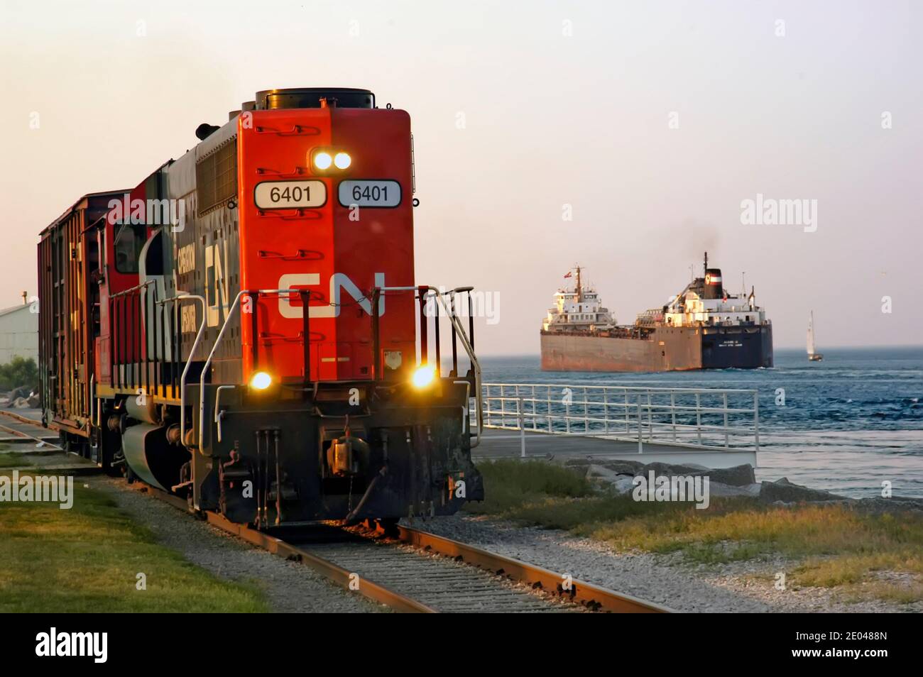 Two forms of shipping transportation with a train engine and shipping ...