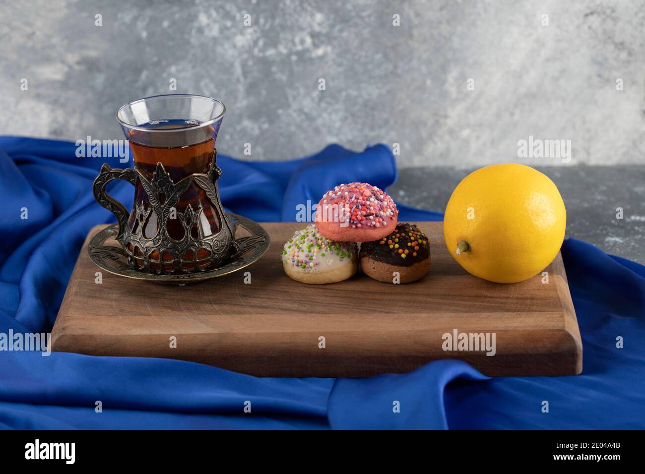 Colorful sweet doughnuts with a cup of tea Stock Photo - Alamy