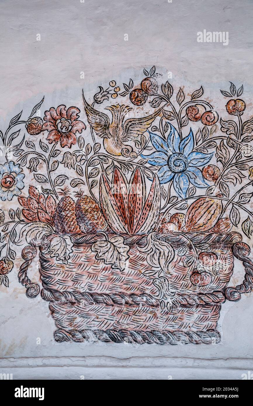 Hand-painted basket of flowers on the wall, Great Cloister, Monasterio ...