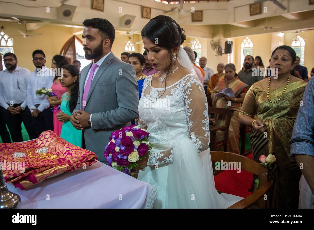 Kerala, India, 08-12-2017. Bride and groom closer to the altar ...