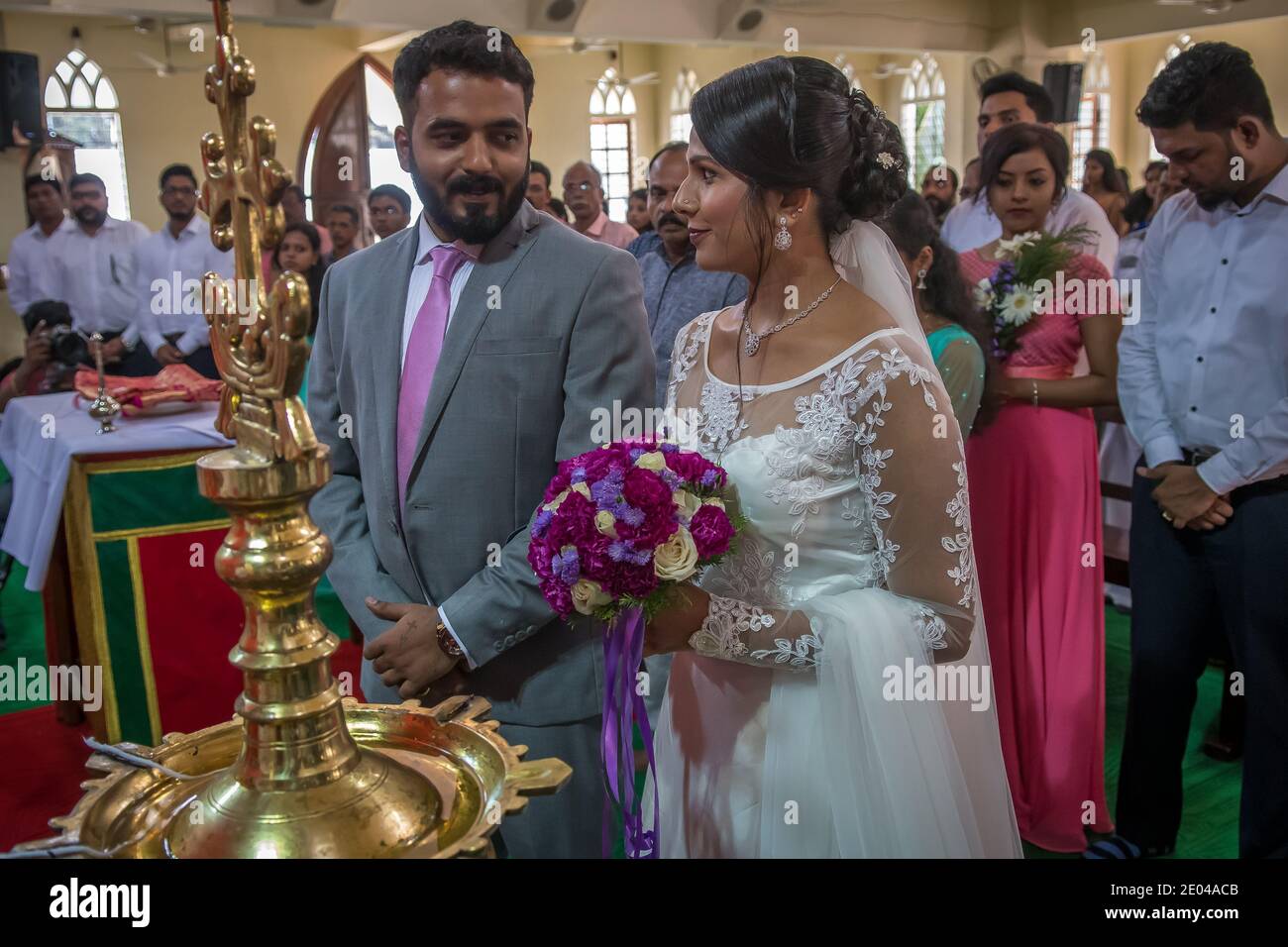 Kerala, India, 08-12-2017. Bride and groom closer to the altar ...