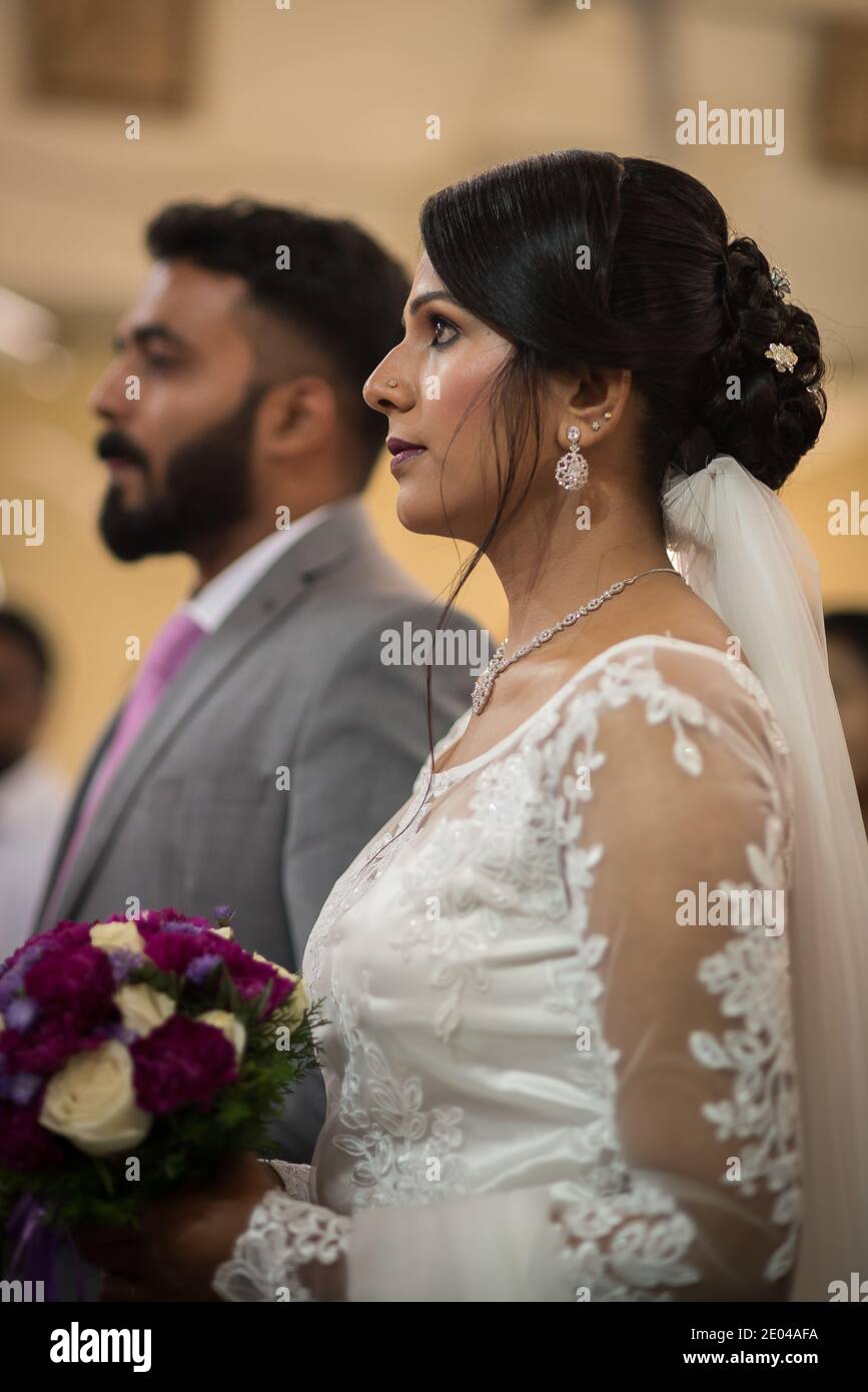 Kerala, India, 08-12-2017. Bride and groom closer to the altar ...