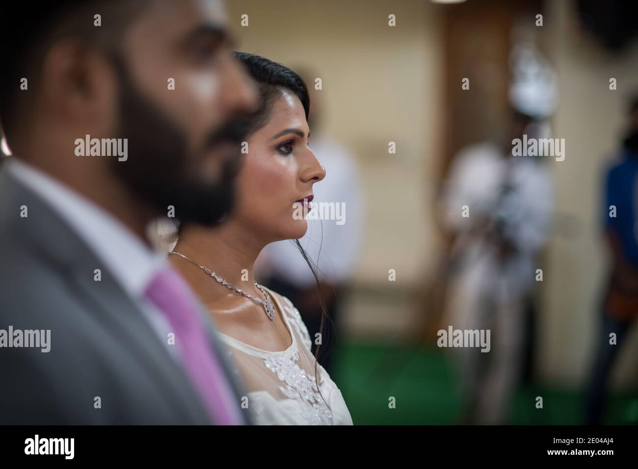 Kerala, India, 08-12-2017. Bride and groom closer to the altar ...