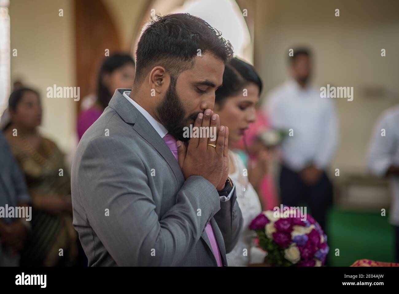 Indian bride praying hi-res stock photography and images - Alamy