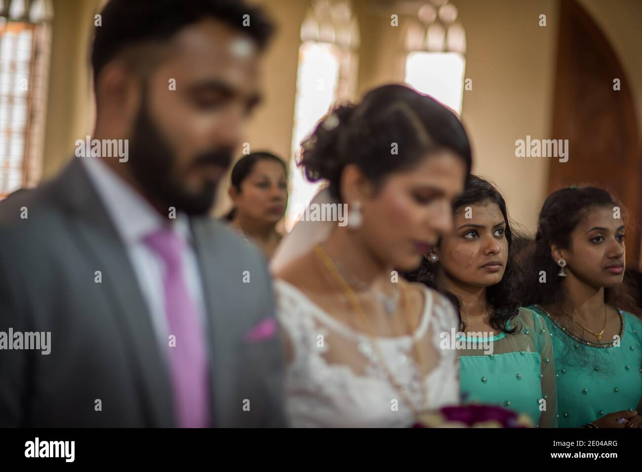 Kerala, India, 08-12-2017. Bride and groom closer to the altar ...