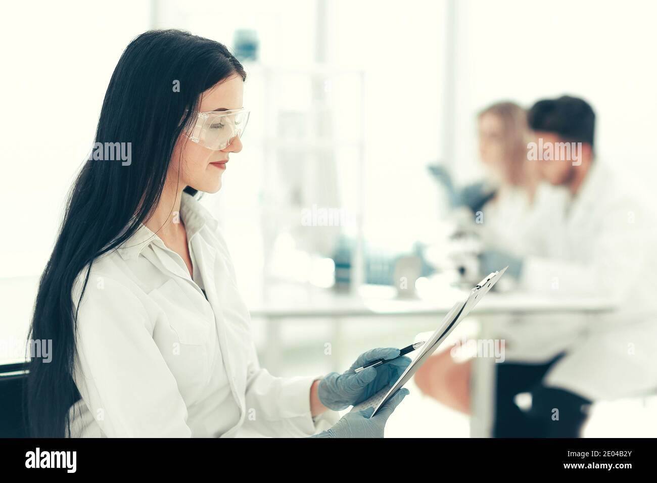 Woman reading science journal hi-res stock photography and images - Alamy
