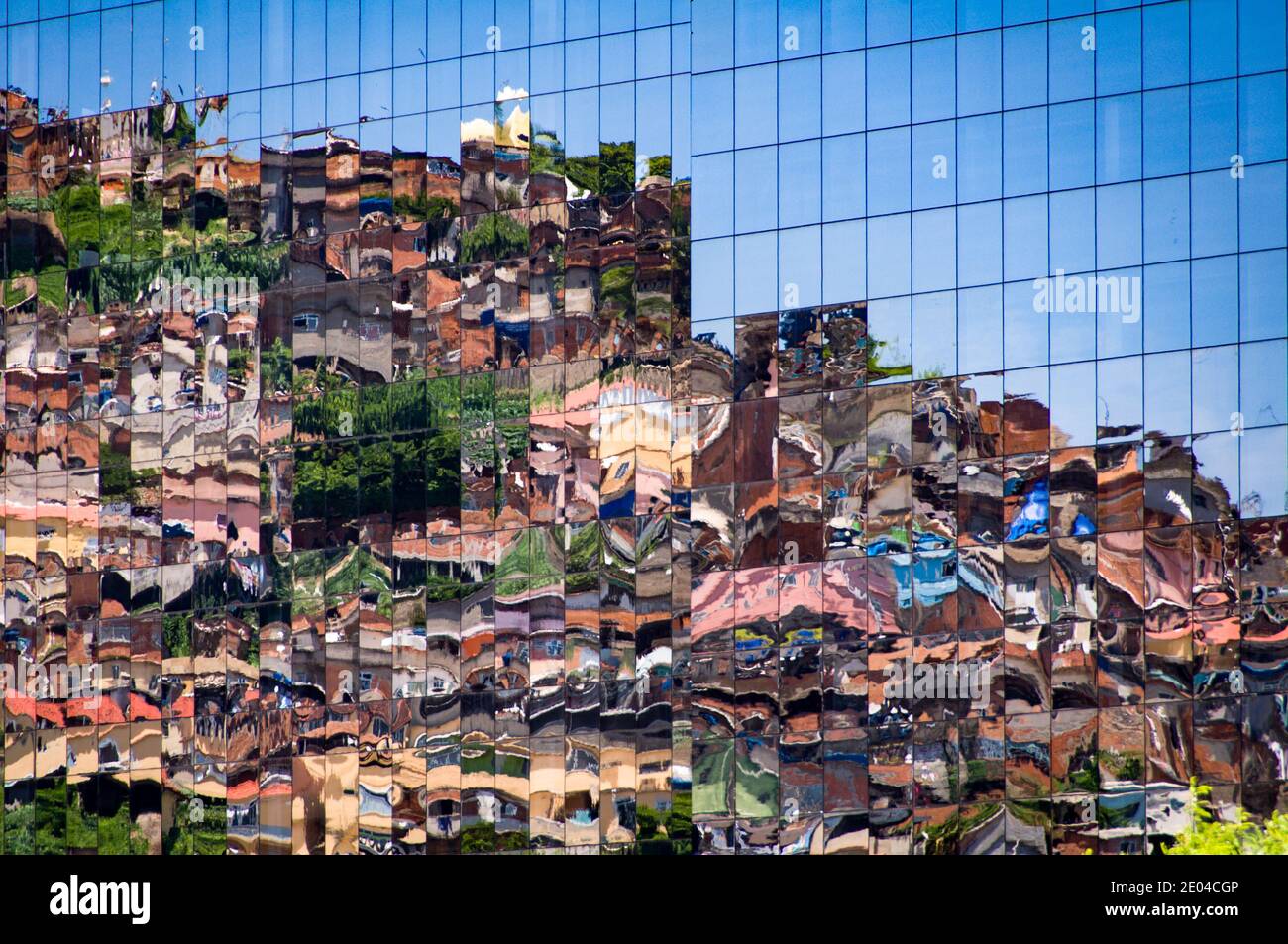 Reflection of Brazilian Slum in Windows of New Modern Business Building ...