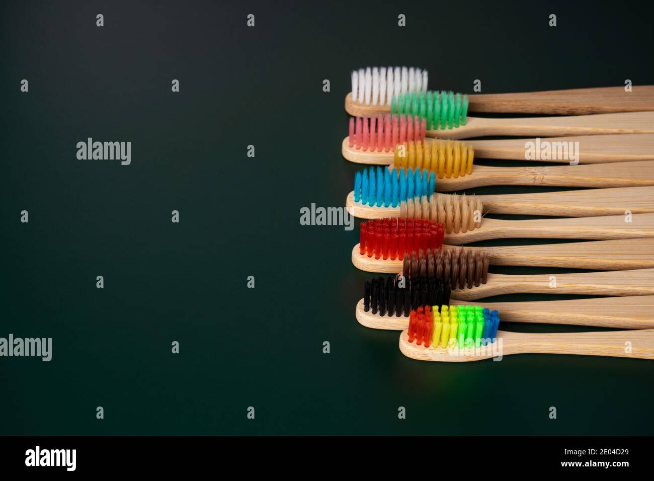 A set of Eco-friendly antibacterial toothbrushes made of bamboo wood on ...