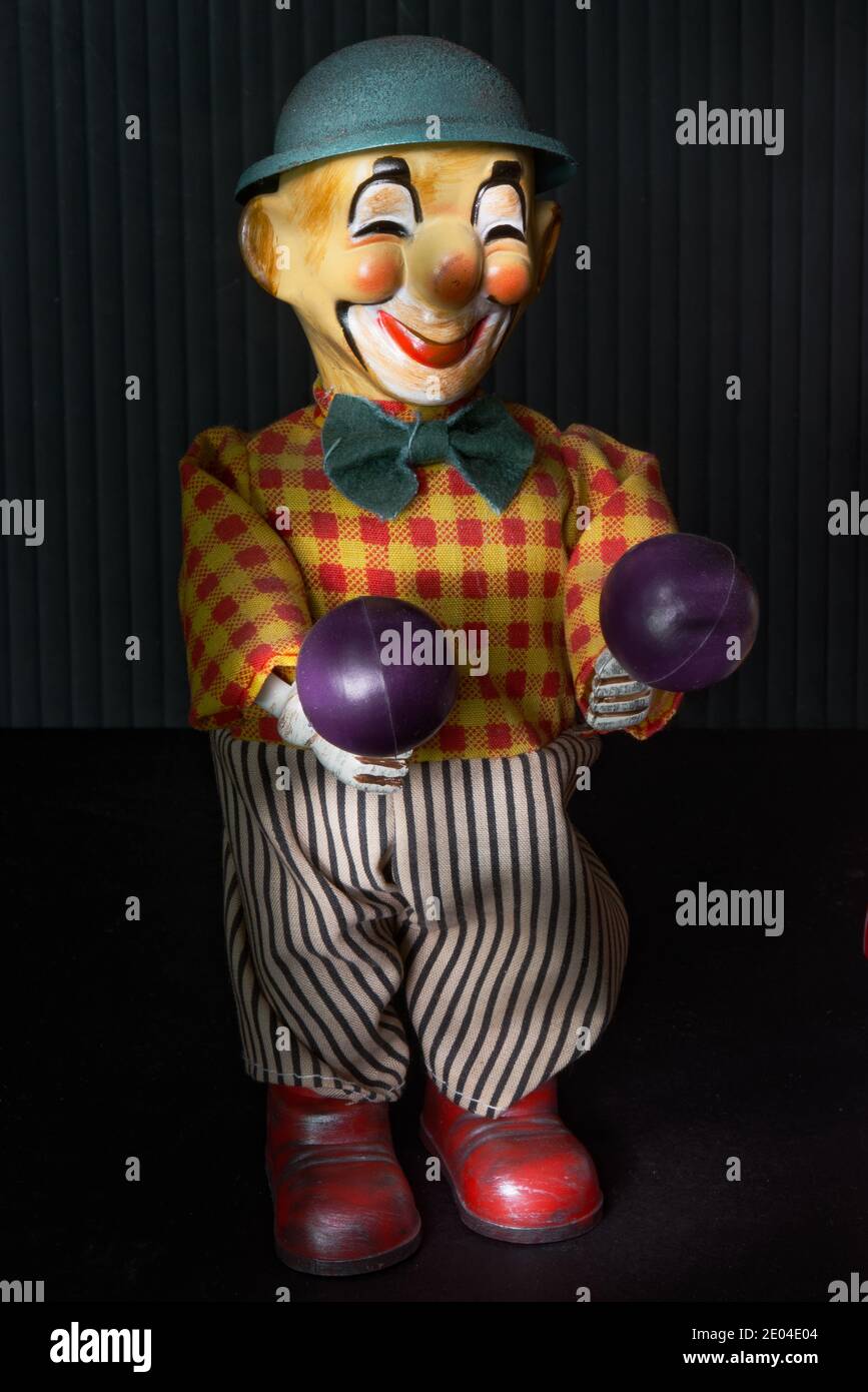 Antique reproduction tin mechanical toy clown Stock Photo - Alamy