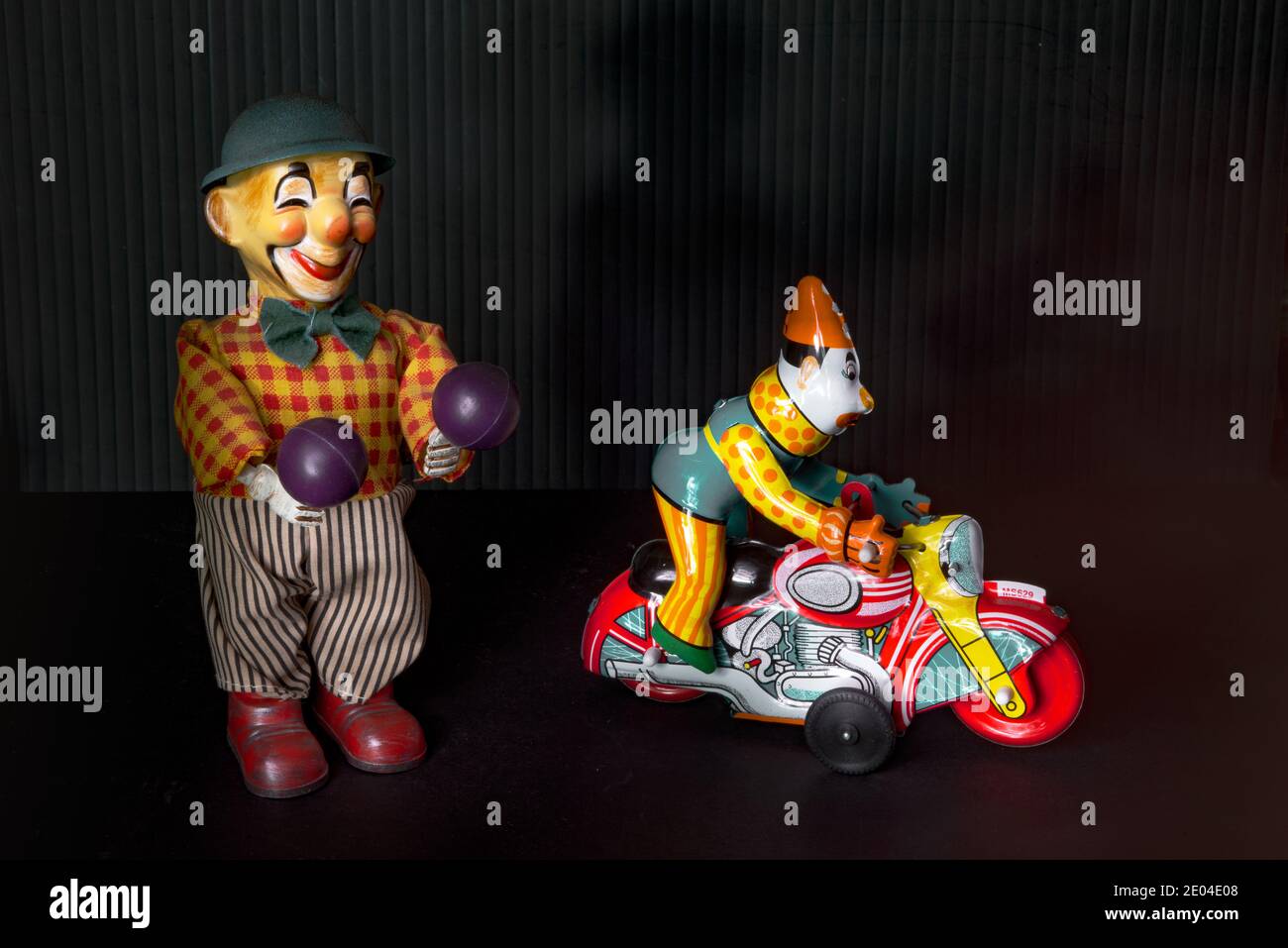 Antique reproduction tin mechanical toy clown Stock Photo - Alamy
