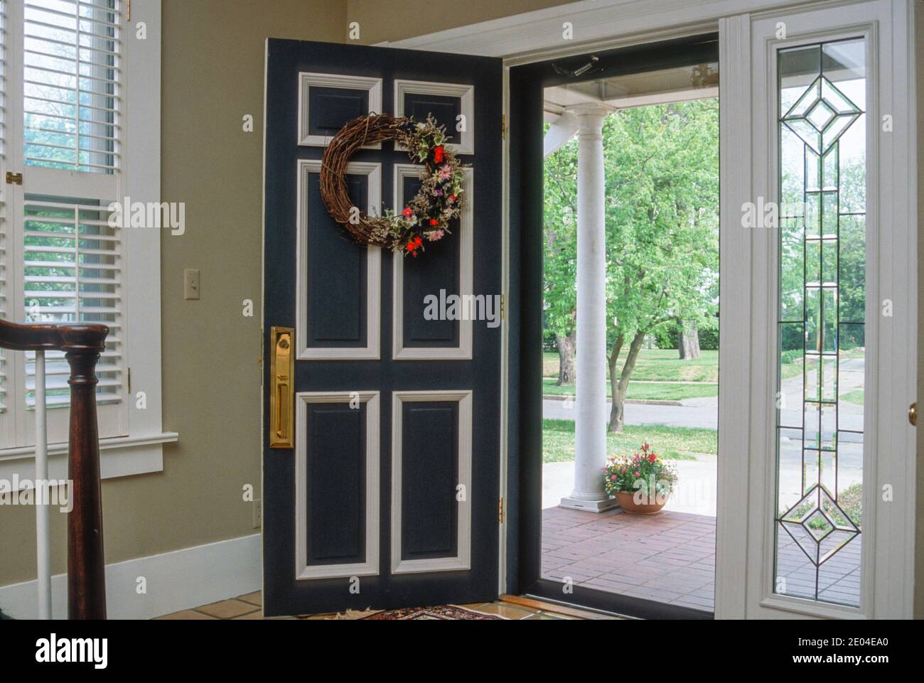 Front door is open to a middle class suburban home, USA Stock Photo - Alamy