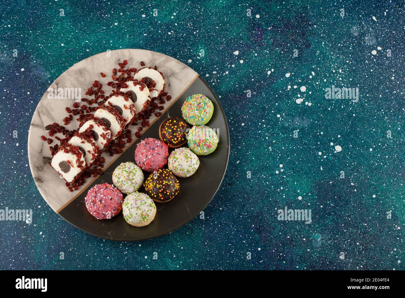 Colorful set of sweet small doughnuts on a plate Stock Photo - Alamy