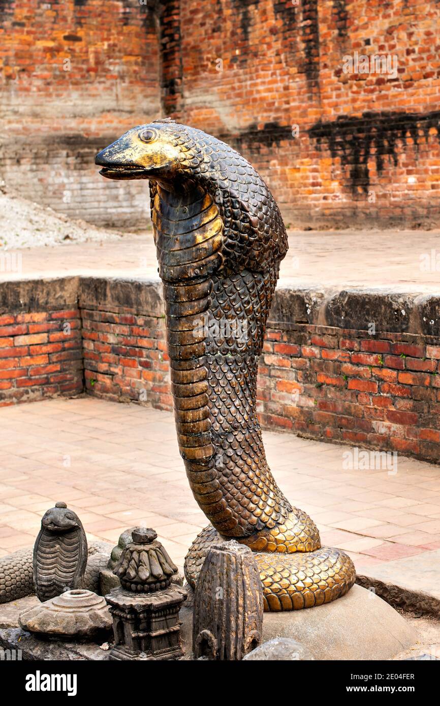 View at the Bronze statues of the mythical Shesh nag guard in a temple ...