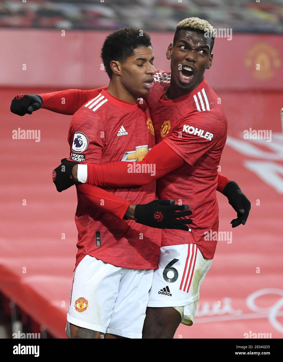 Manchester United's Marcus Rashford (left) celebrates scoring his side ...