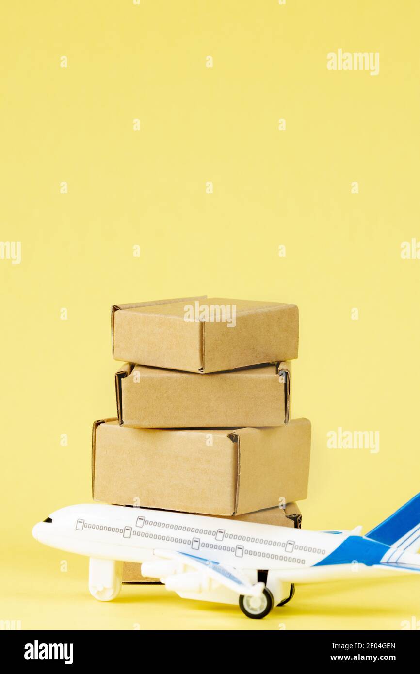 Airplane and stack of cardboard boxes. concept of air cargo and parcels ...