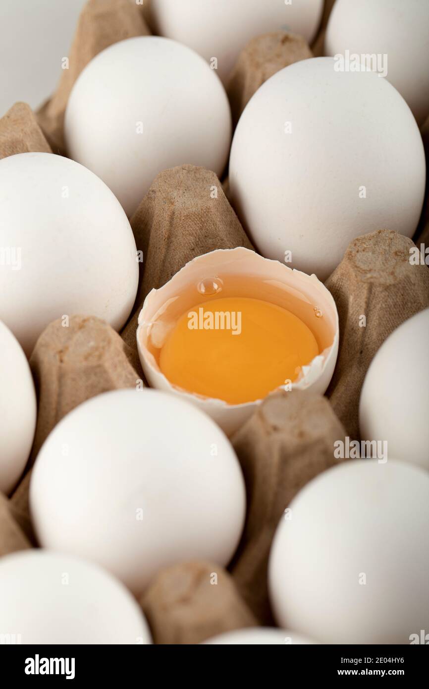 Raw chicken eggs in a carton container Stock Photo - Alamy